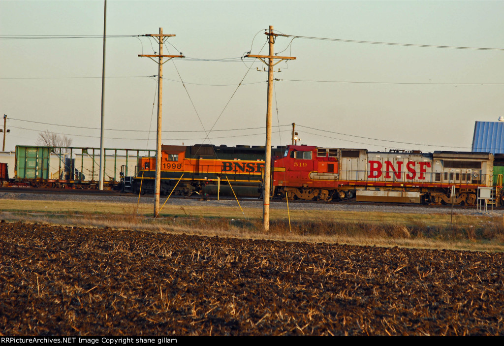 BNSF 519 and bnsf 1998 sit silent.